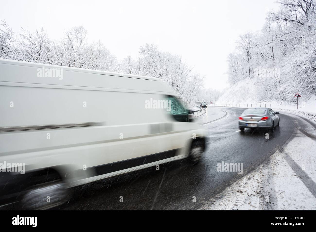 snowy road at cold wintertime with fast van Stock Photo - Alamy