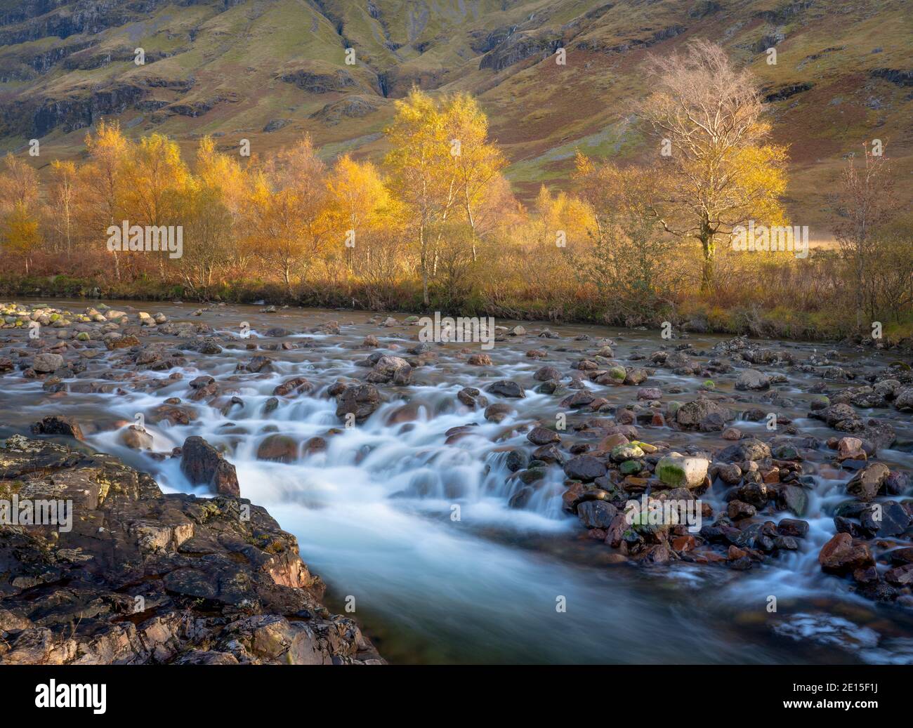 Glencoe, Scotland: River Coe flowing through highland hills in autumn ...