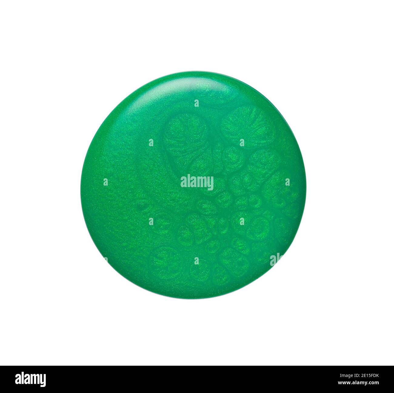 A green sample color paint puddle photographed on a white background ...