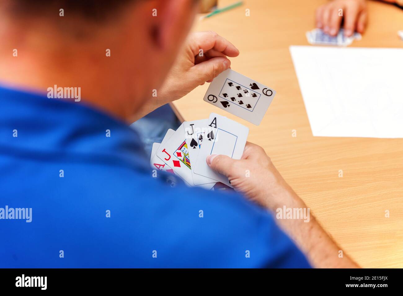 Asian family playing cards hi-res stock photography and images - Alamy
