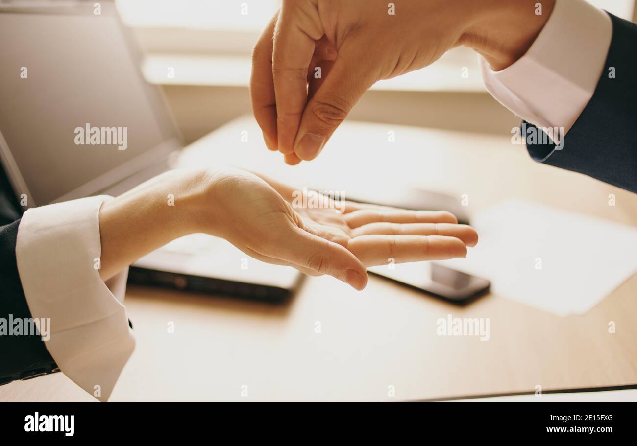 handing the key from hand to hand and office business finance work ...