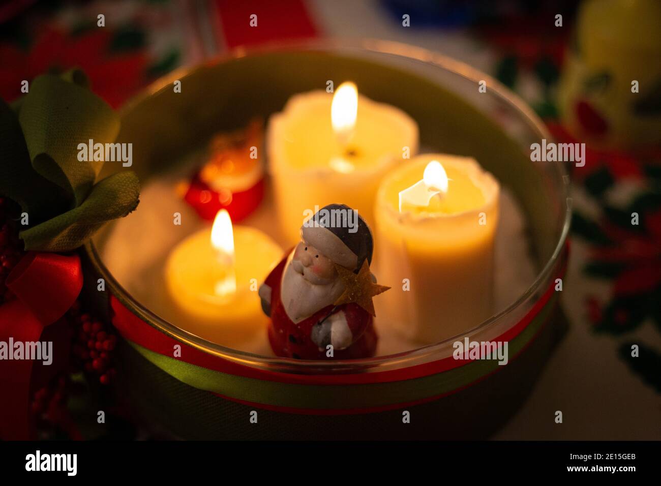 Christmas candles with Santa Claus Stock Photo - Alamy