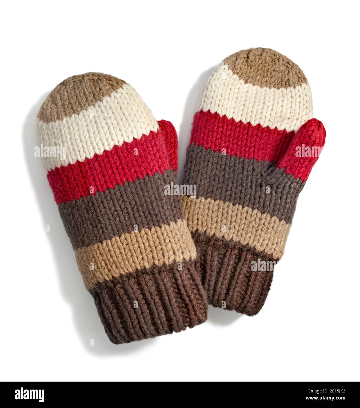 Brown and red striped knitted mittens photographed on a white ...