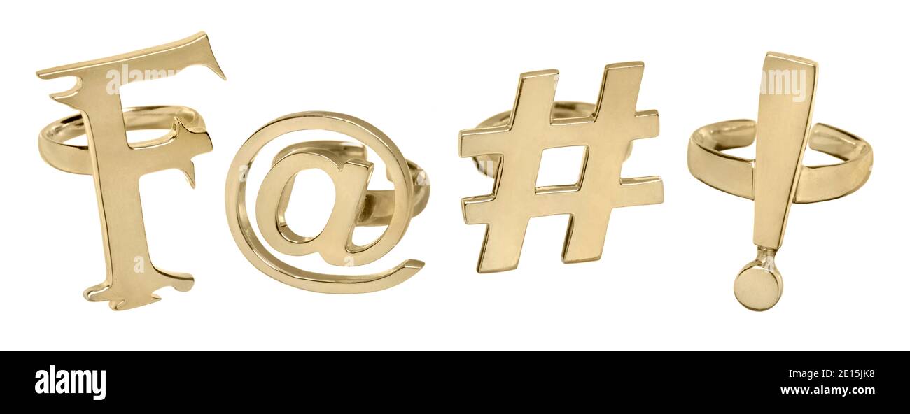 Gold letter and symbol censored profanity ring set photographed on a ...