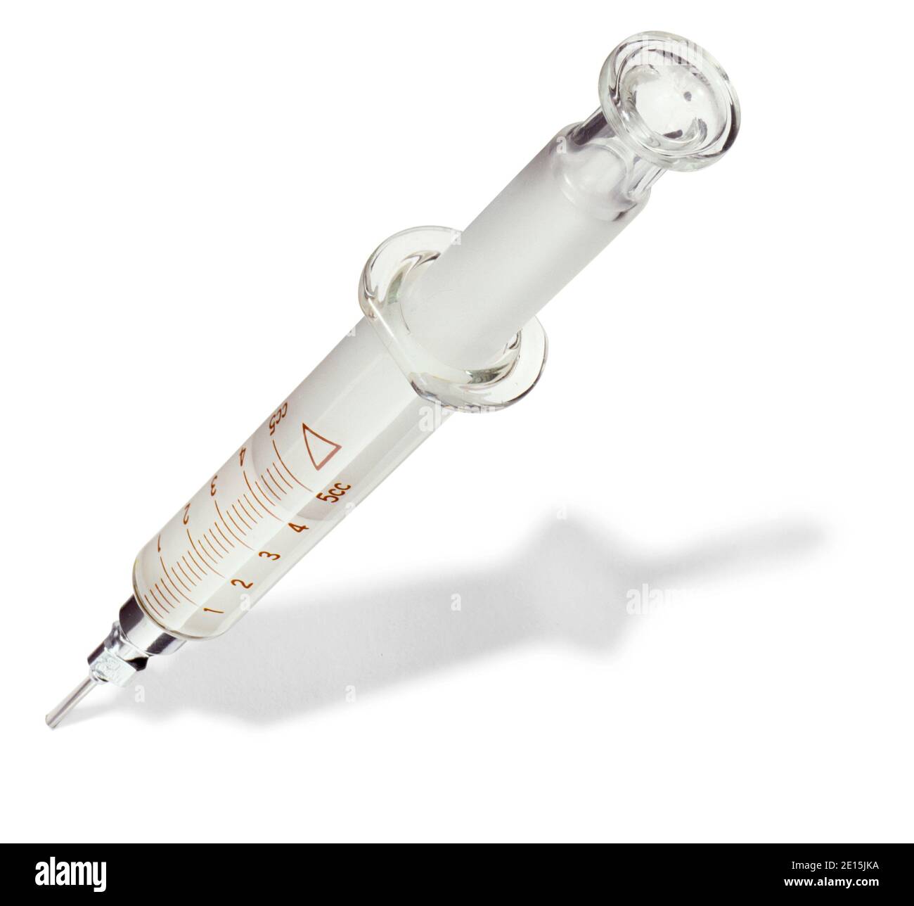 Syringe pointing diagonal to the left photographed on a white ...