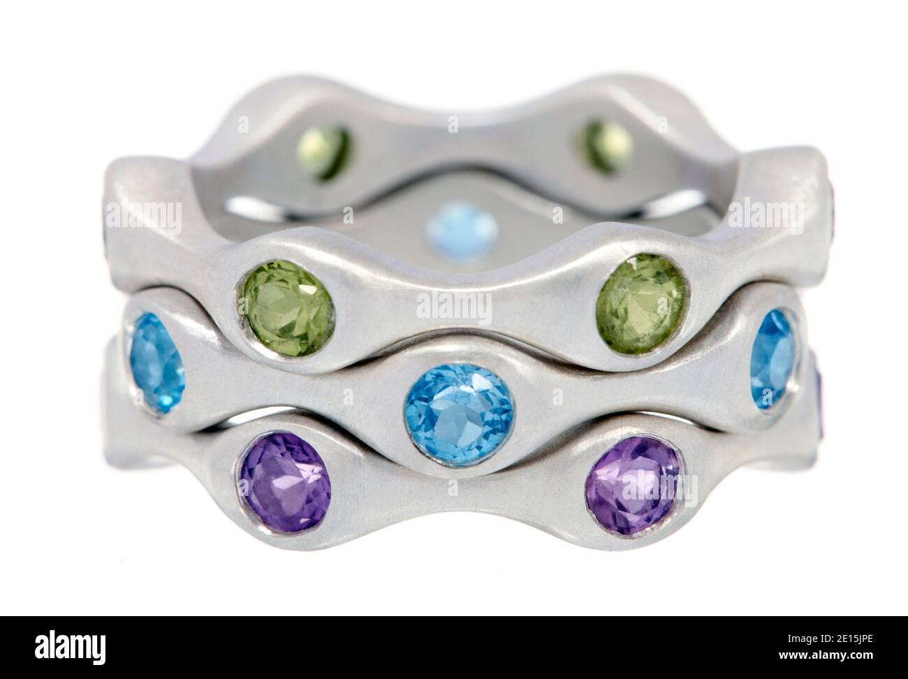 Triple stack gemstone rings photographed on a white background Stock ...