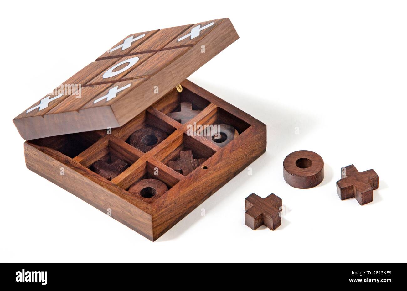 Wooden tic tac toe box set with wooden pieces photographed on a white ...
