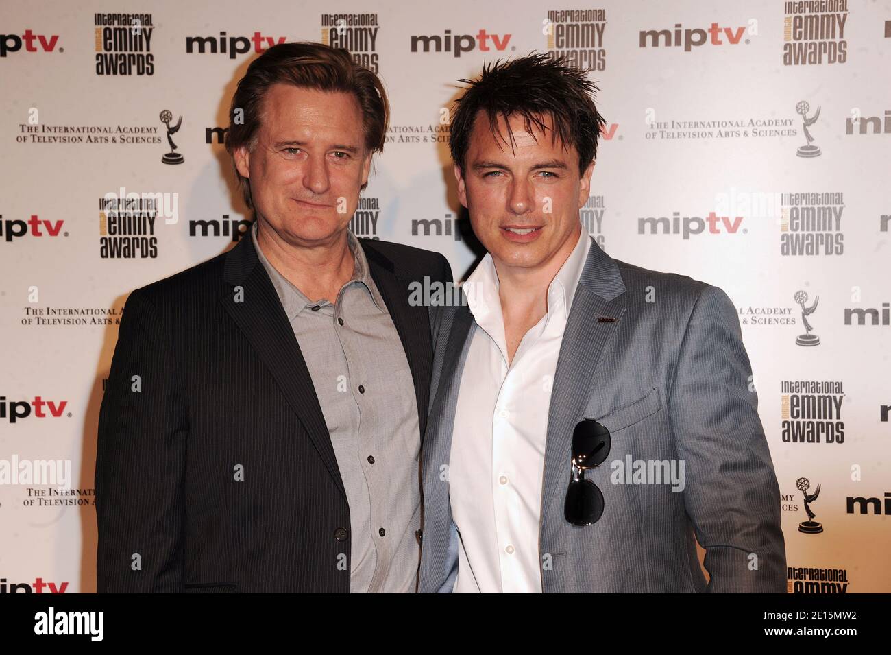 Bill Pullman and John Barrowman attend the MIPTV 2011 Opening Cocktail ...