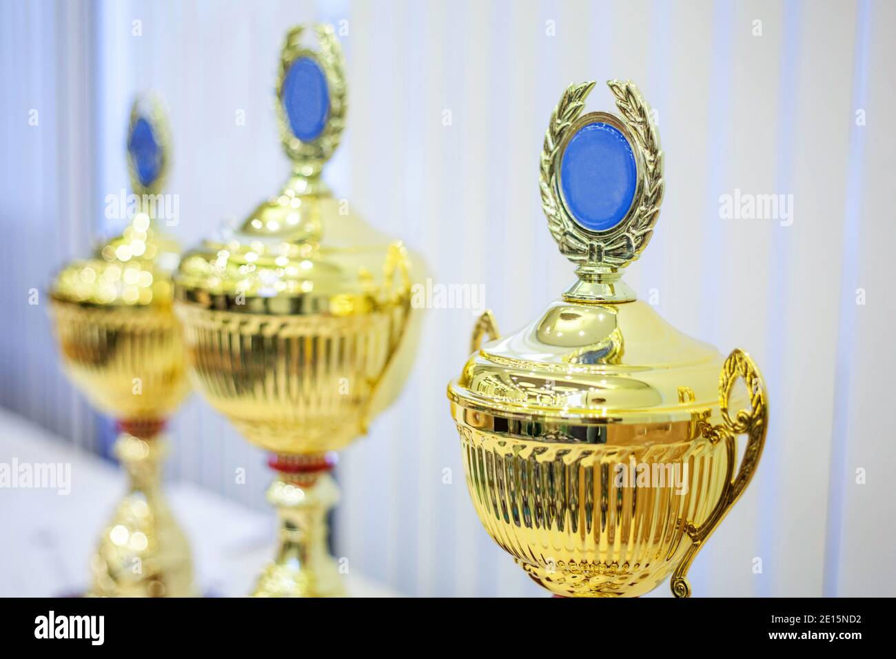 Three cup trophies, gold, silver and bronze Stock Photo - Alamy