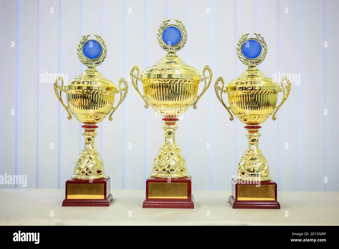 Three cup trophies, gold, silver and bronze Stock Photo - Alamy