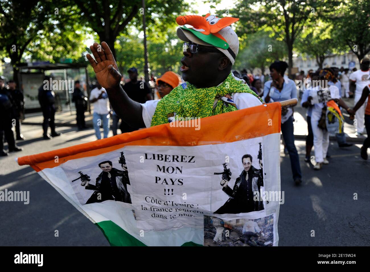 Members of the Ivory Coast community in France demonstrate in support ...