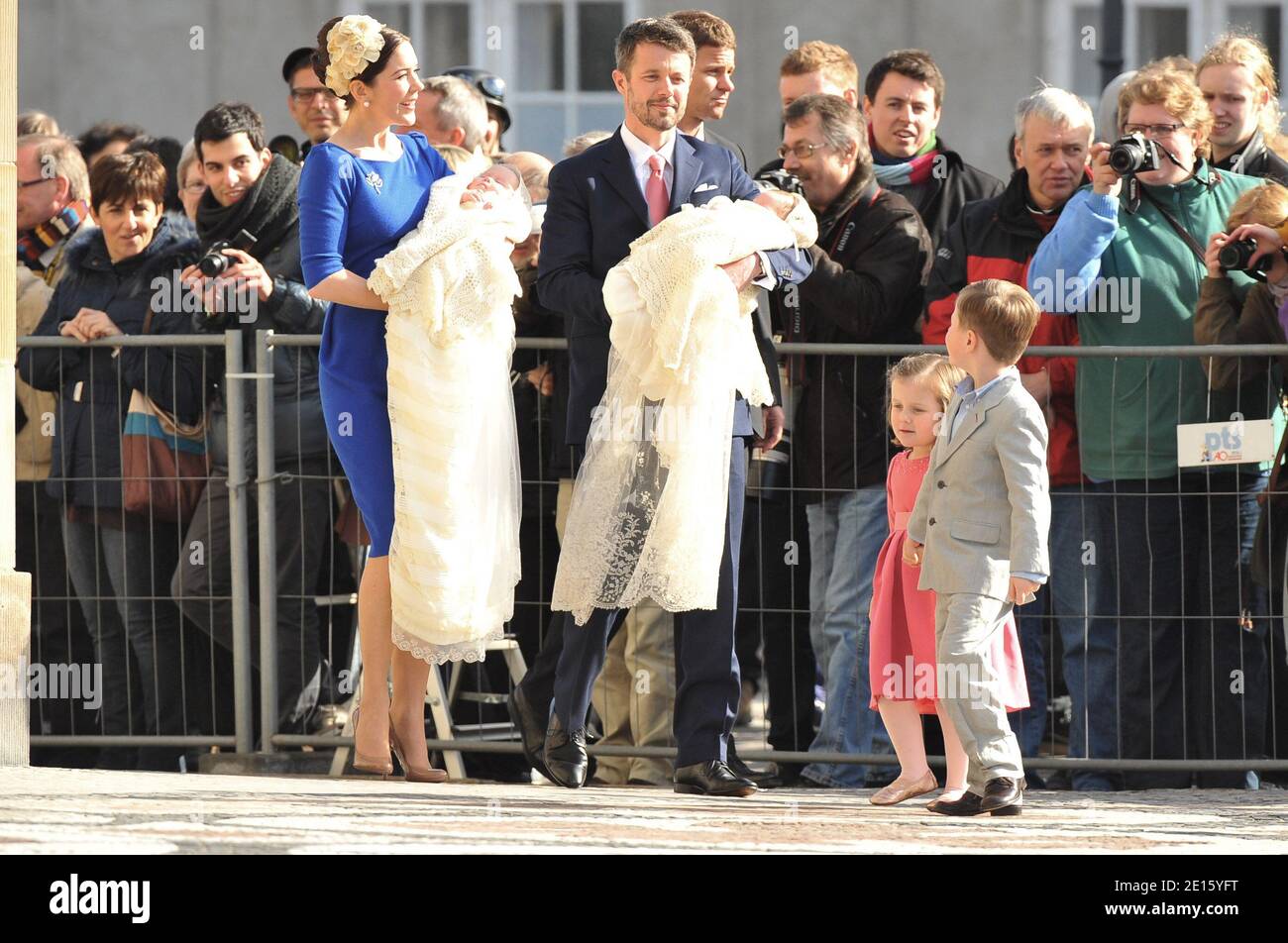 Crown Prince Frederik and Crown Princess Mary of Denmark carrying their ...