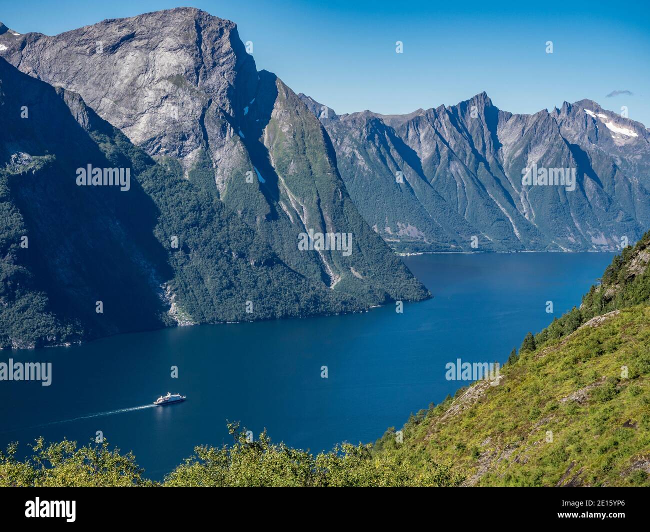 View over the Hjorundfjord, cruise ship leaves towards west, above ...