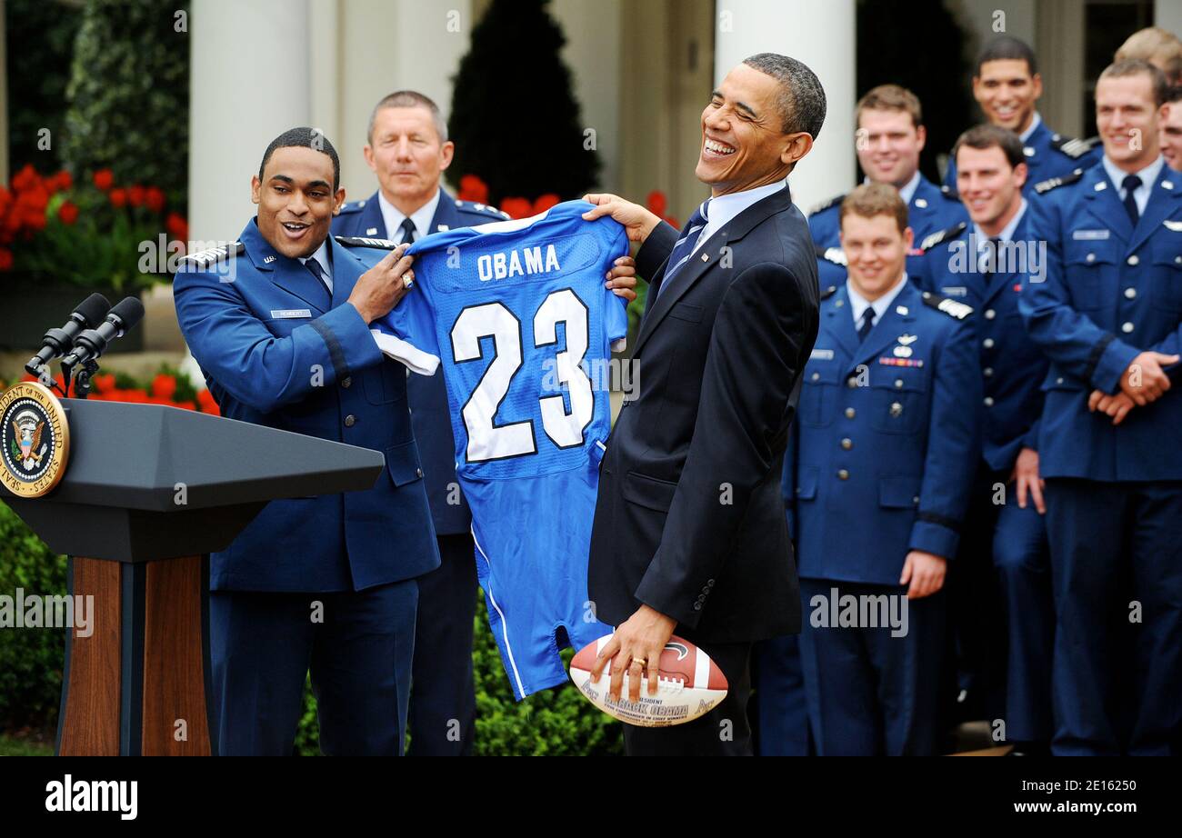 US President Barack Obama receives gifts as he presents the Commander ...
