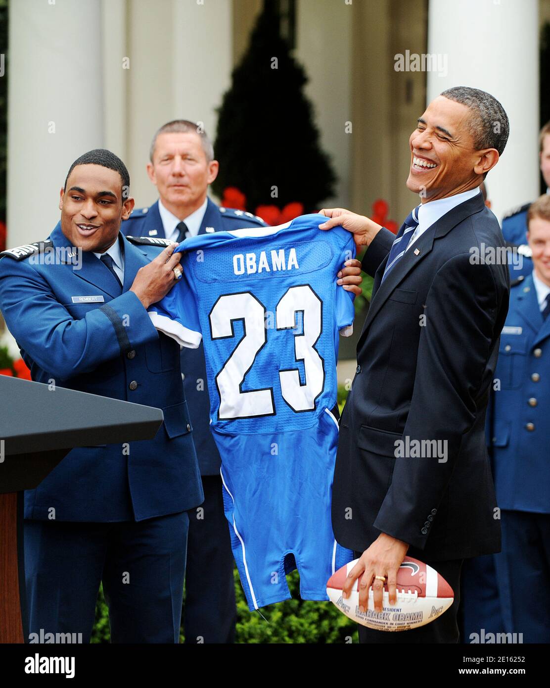 US President Barack Obama receives gifts as he presents the Commander ...