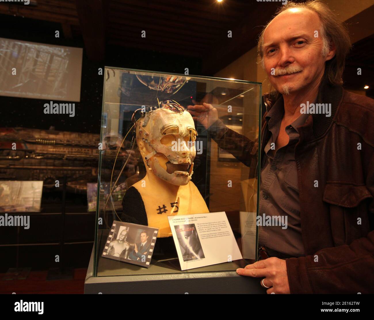 Museum founder Dan Ohlman poses next to a device of 'Bicentennial Man ...