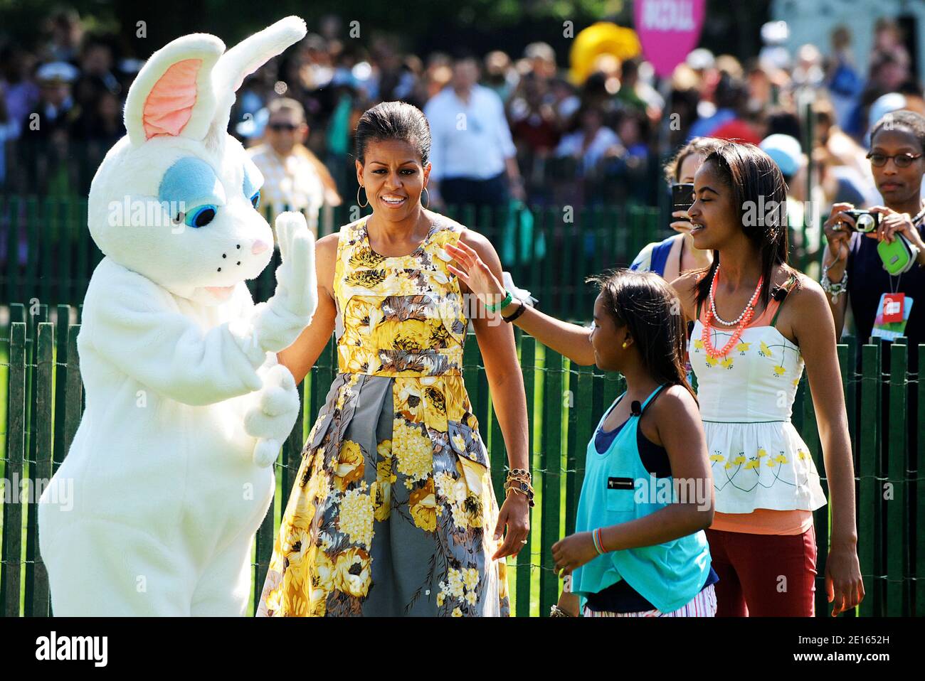 First lady Michelle Obama and daughters Sasha and Malia attend the ...