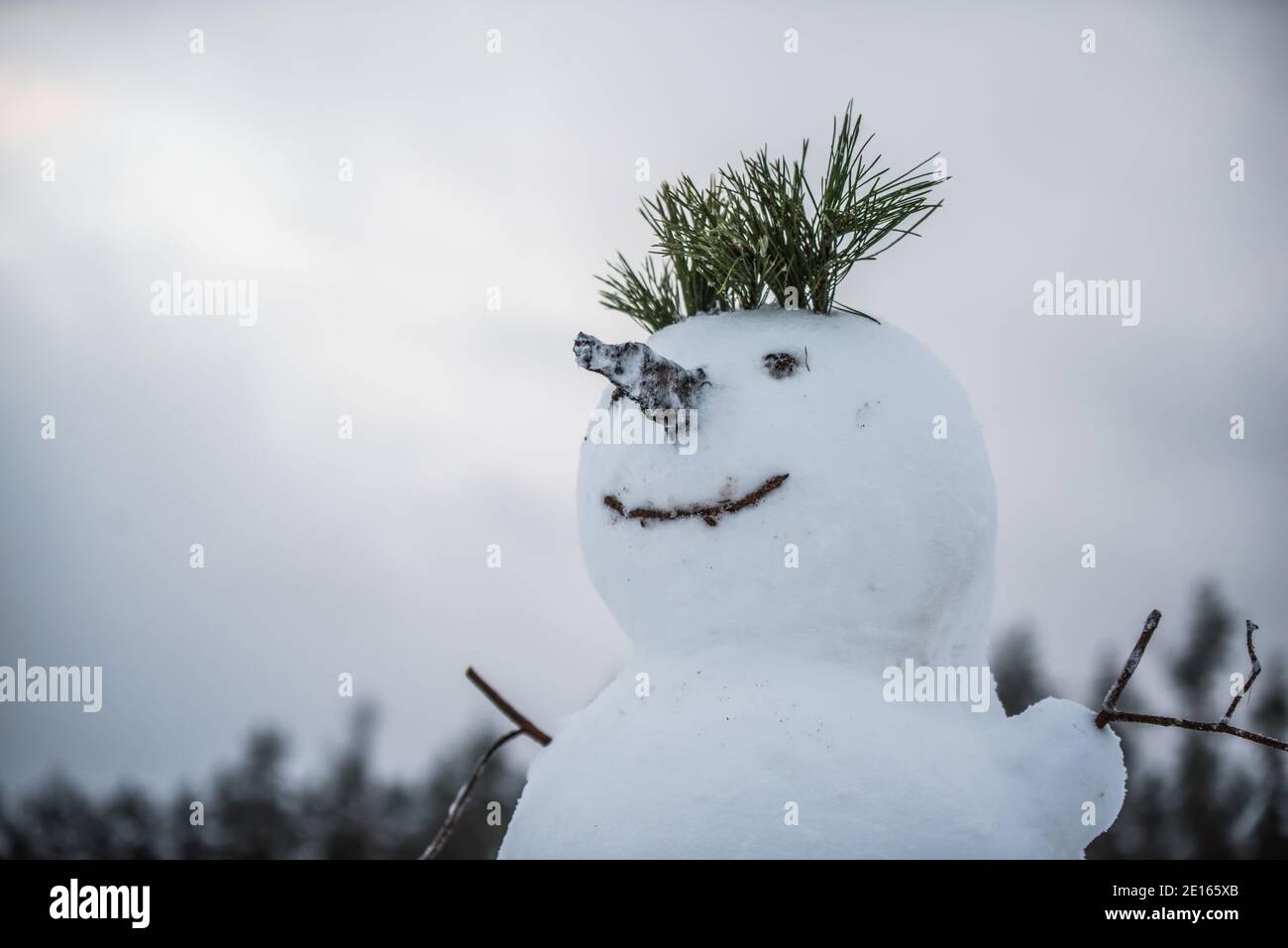 Beautiful snowman. Making a snowman. The first snow in Europe. Making a ...