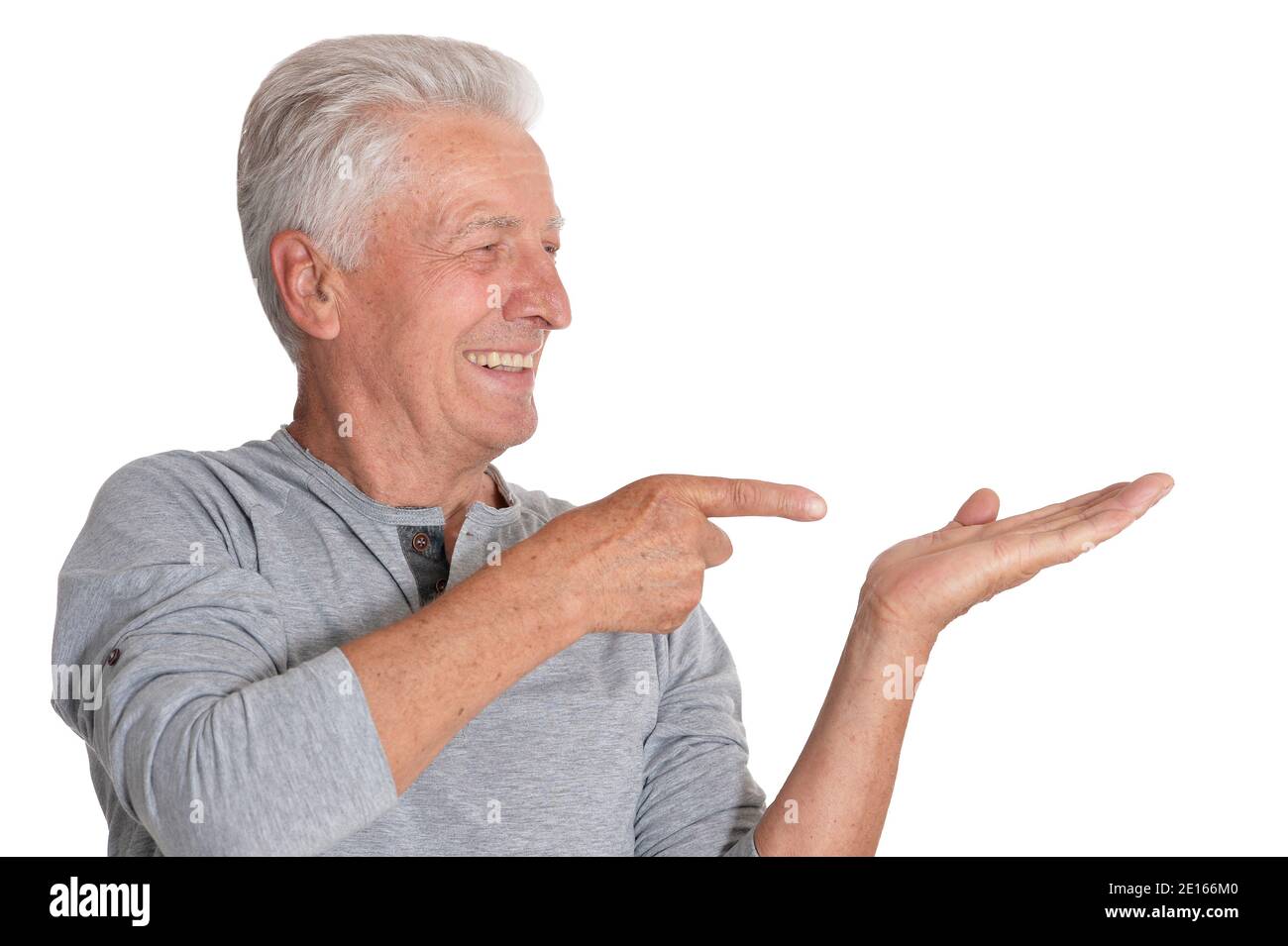Senior man showing something isolated on white background Stock Photo ...