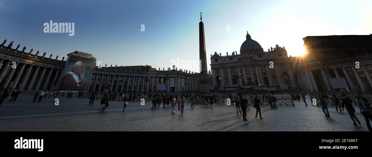 People walk past a giant placard showing picture of late pope John Paul ...