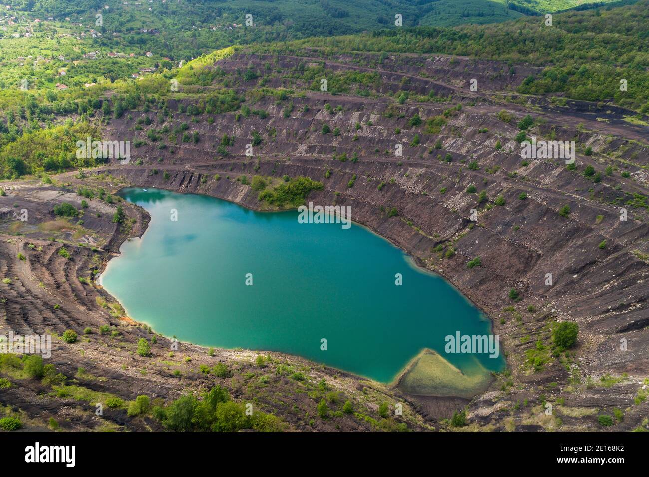 Aerial view, deep mine lake in place of a mining pit Stock Photo - Alamy