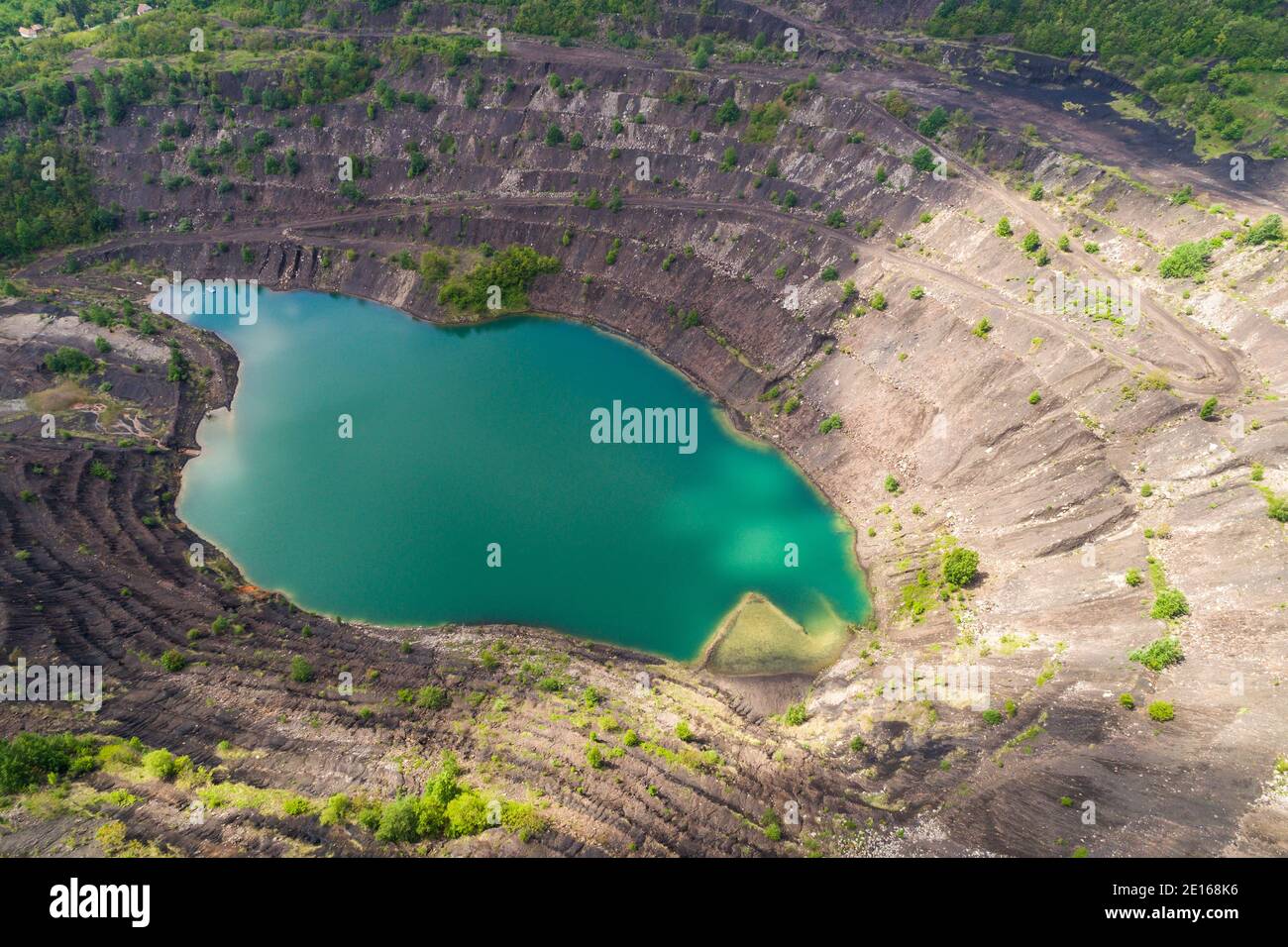 Aerial view, deep mine lake in place of a mining pit Stock Photo - Alamy