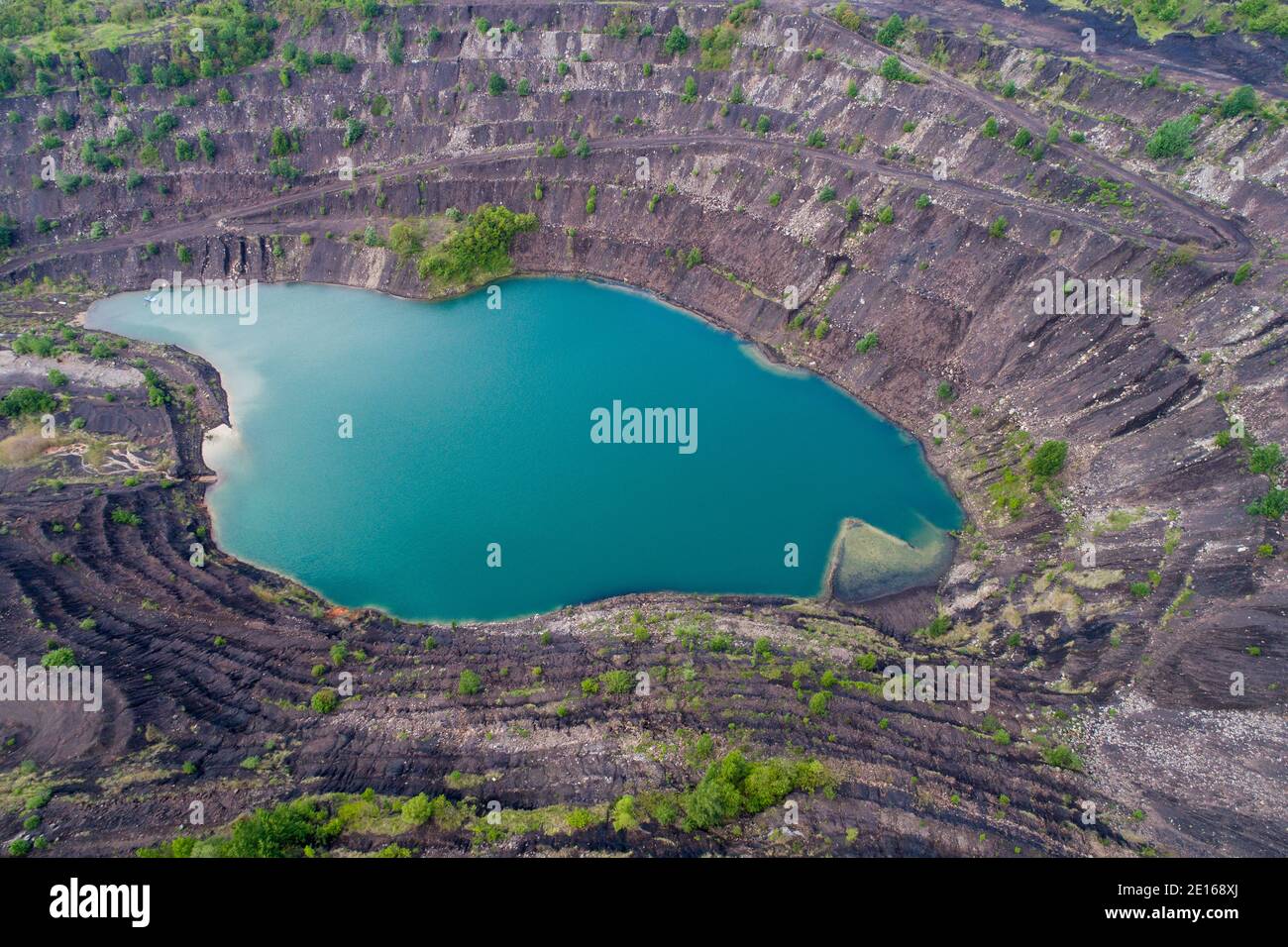 Aerial view, deep mine lake in place of a mining pit Stock Photo - Alamy