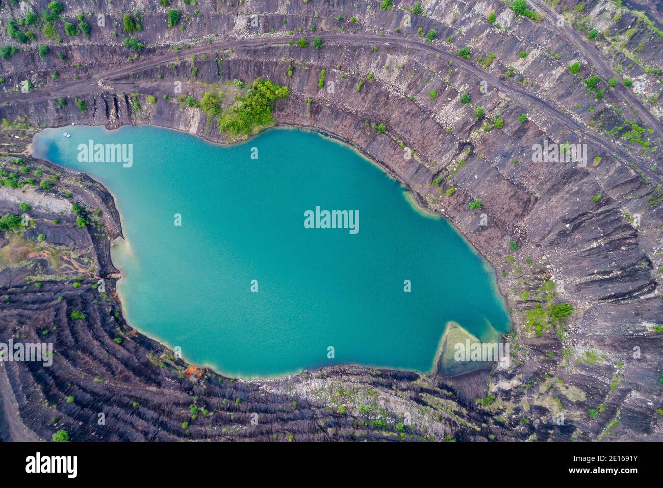 Aerial view, deep mine lake in place of a mining pit Stock Photo - Alamy