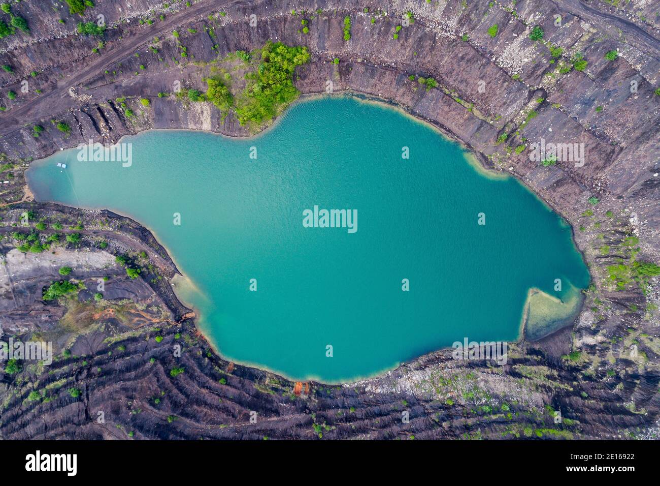 Aerial view, deep mine lake in place of a mining pit Stock Photo - Alamy