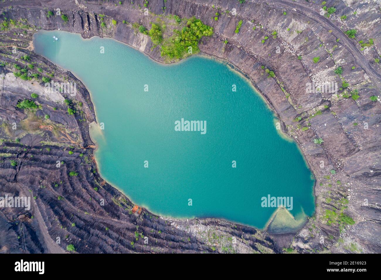Aerial view, deep mine lake in place of a mining pit Stock Photo - Alamy