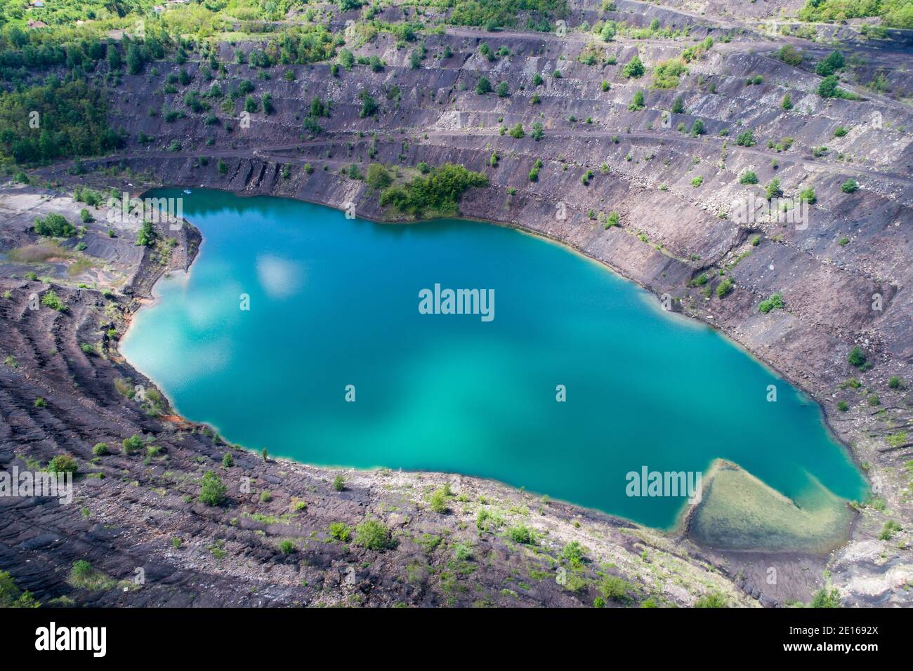 Aerial view, deep mine lake in place of a mining pit Stock Photo - Alamy