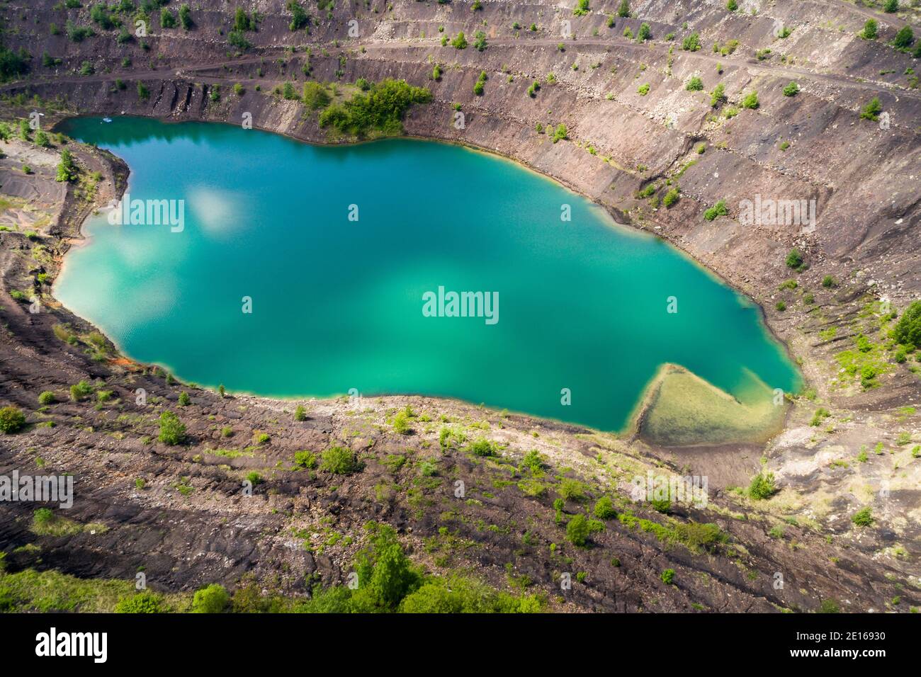Aerial view, deep mine lake in place of a mining pit Stock Photo - Alamy