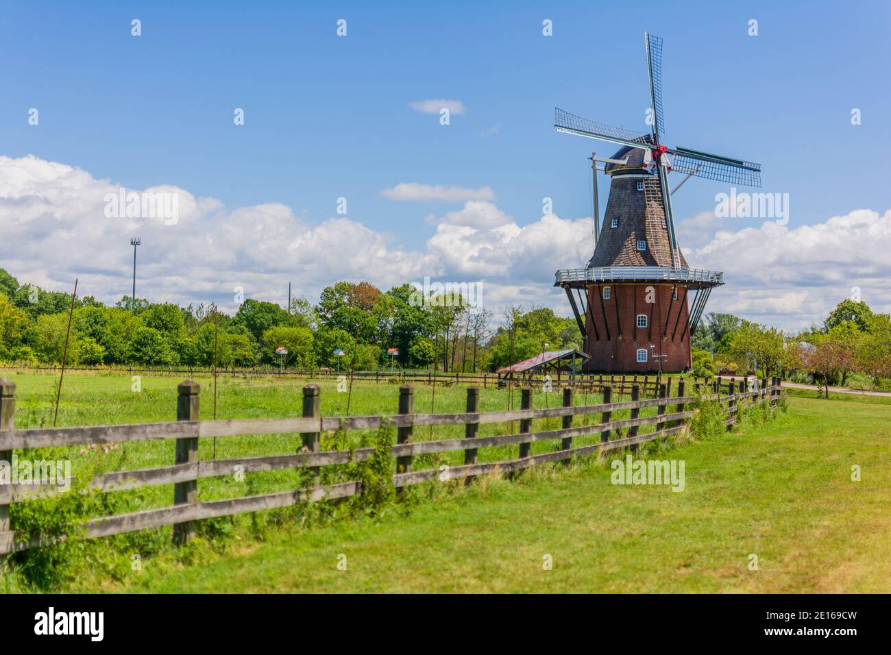 Dutch windmill over a farm Stock Photo - Alamy