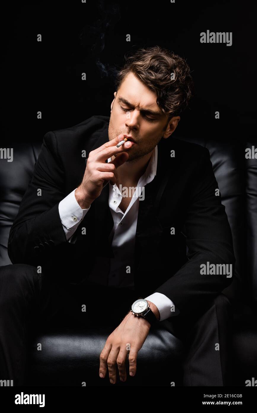 One man smoking sofa hi-res stock photography and images - Alamy
