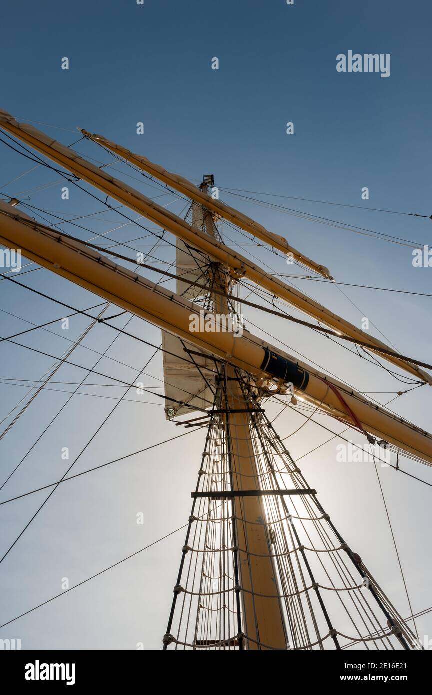 View looking up wooden mast with ropes and rigging from an old sailing ...