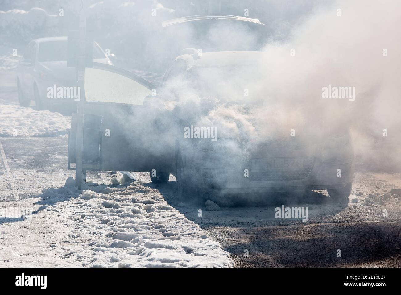 PECS, HUNGARY - JANUARY 21: Burning Car on road Pecs in wintertime ...