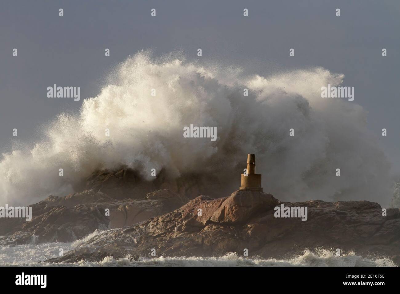 Storm on the coast seeig big wave breaking over rocks and cliffs seeing ...