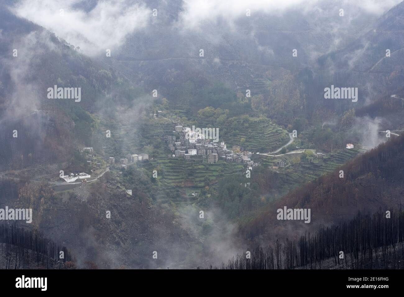 Piodao, an old shale mountain village in a foggy morning, Portugal ...