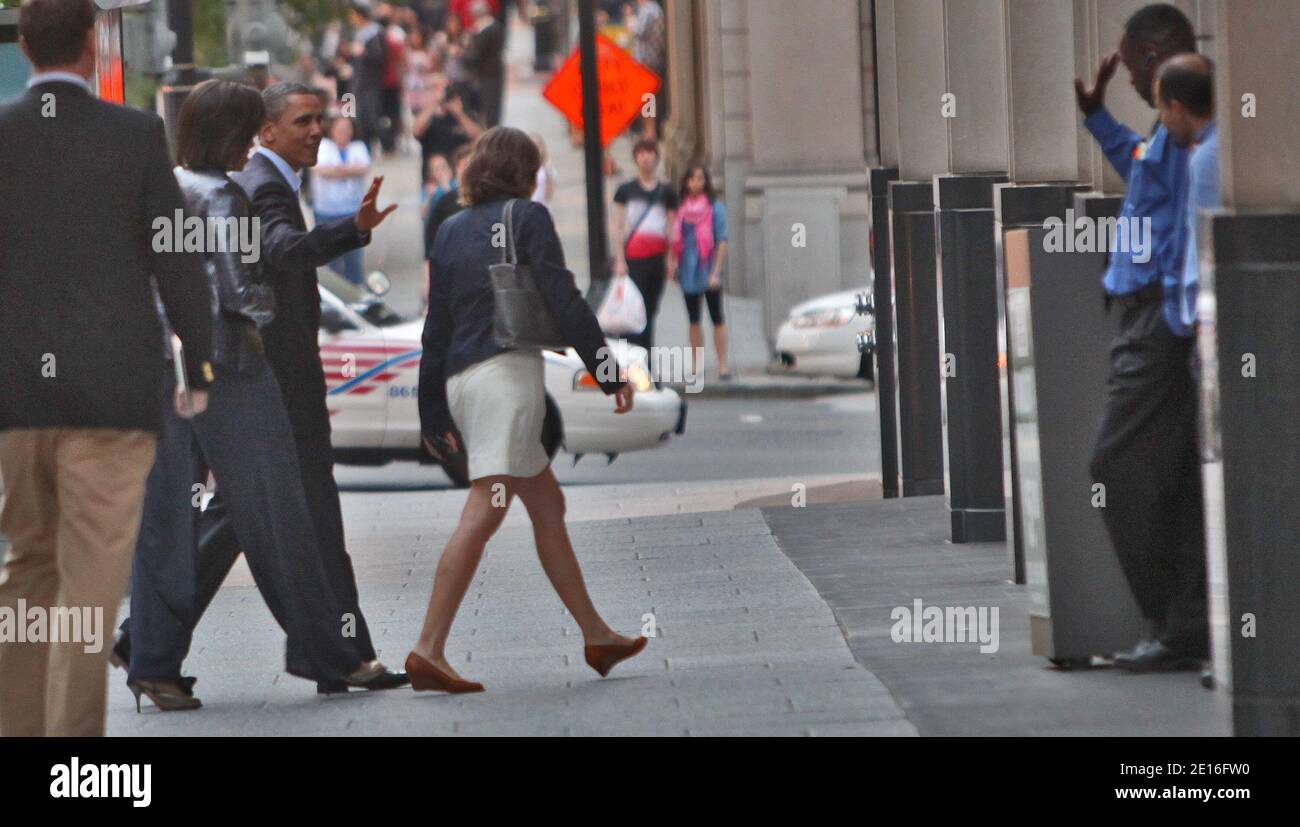 US President Barack Obama and First Lady Michelle Obama wave to ...