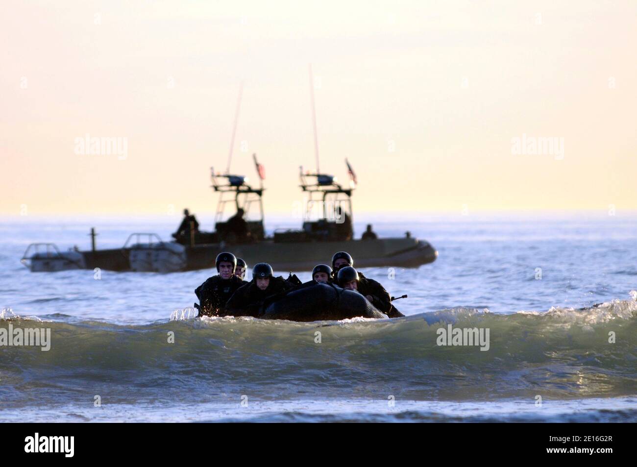 Students in Sea Air and Land (SEAL) qualification training navigate the ...