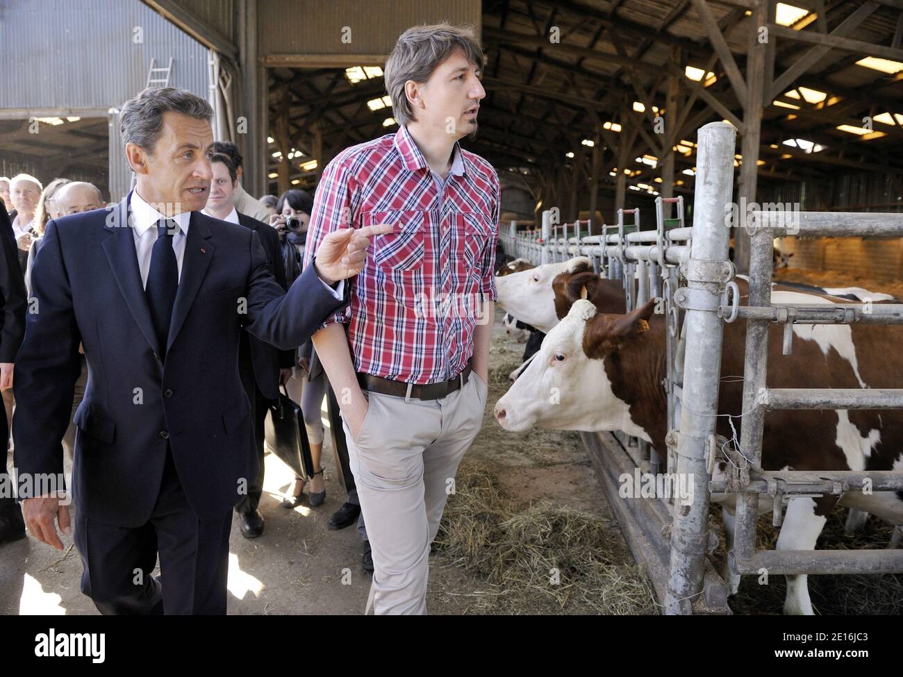 French President Nicolas Sarkozy (L) talks with Mickael Poillon during ...