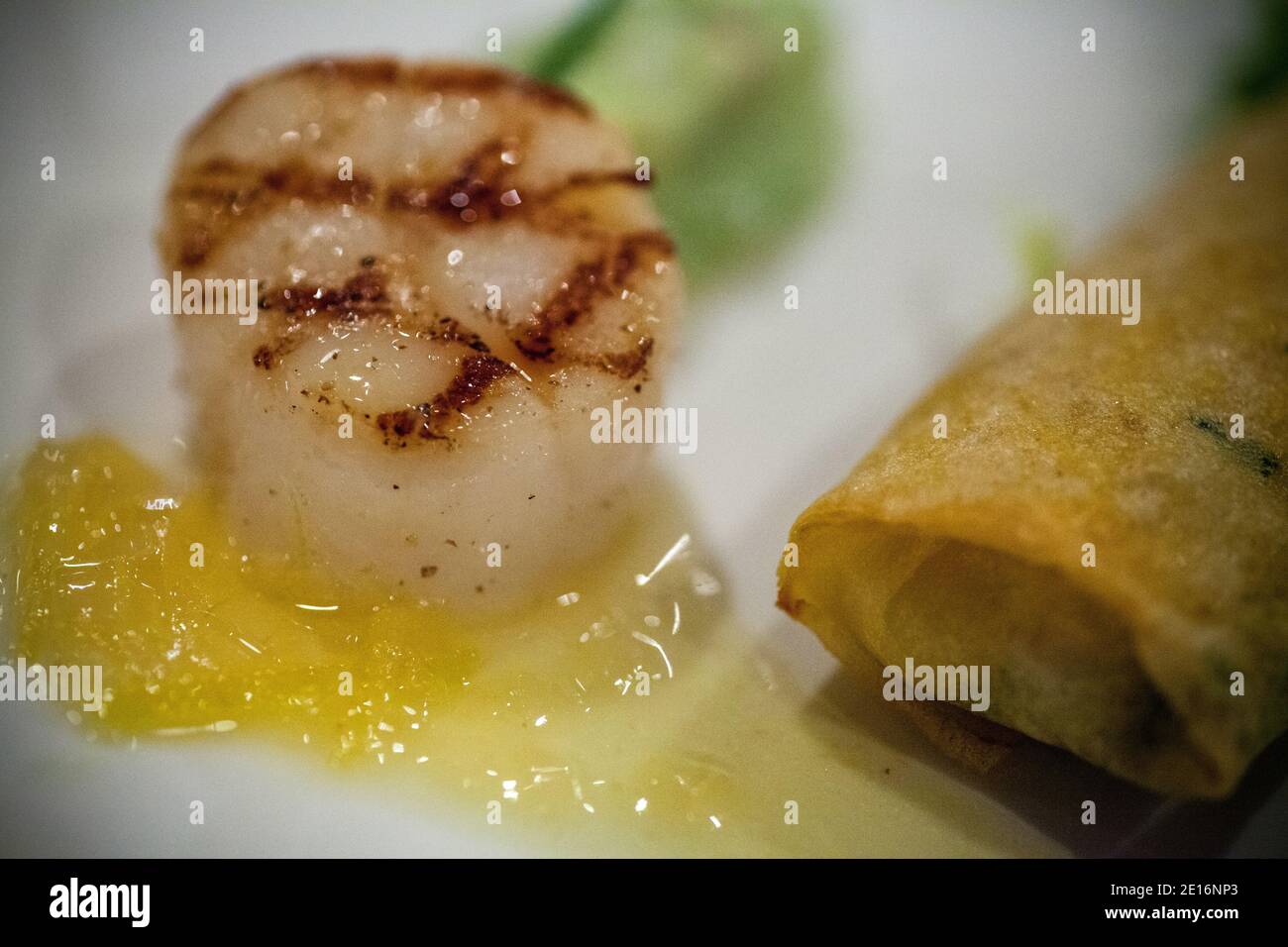 Fried sweetbread, a delicacy, decorated with herbs,against a light ...