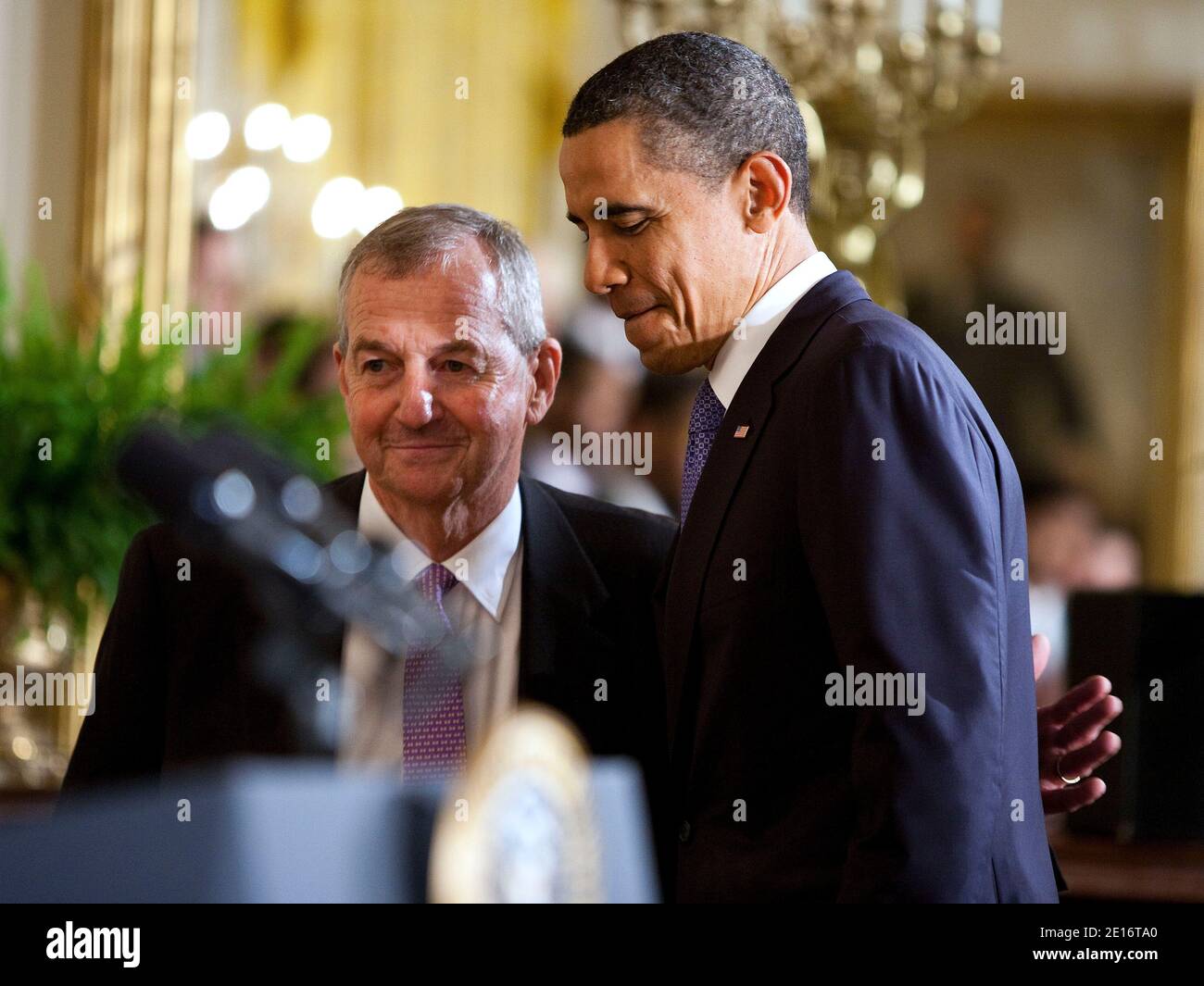 U.S. President Barack Obama greets Head Coach Jim Calhoun at a ceremony ...