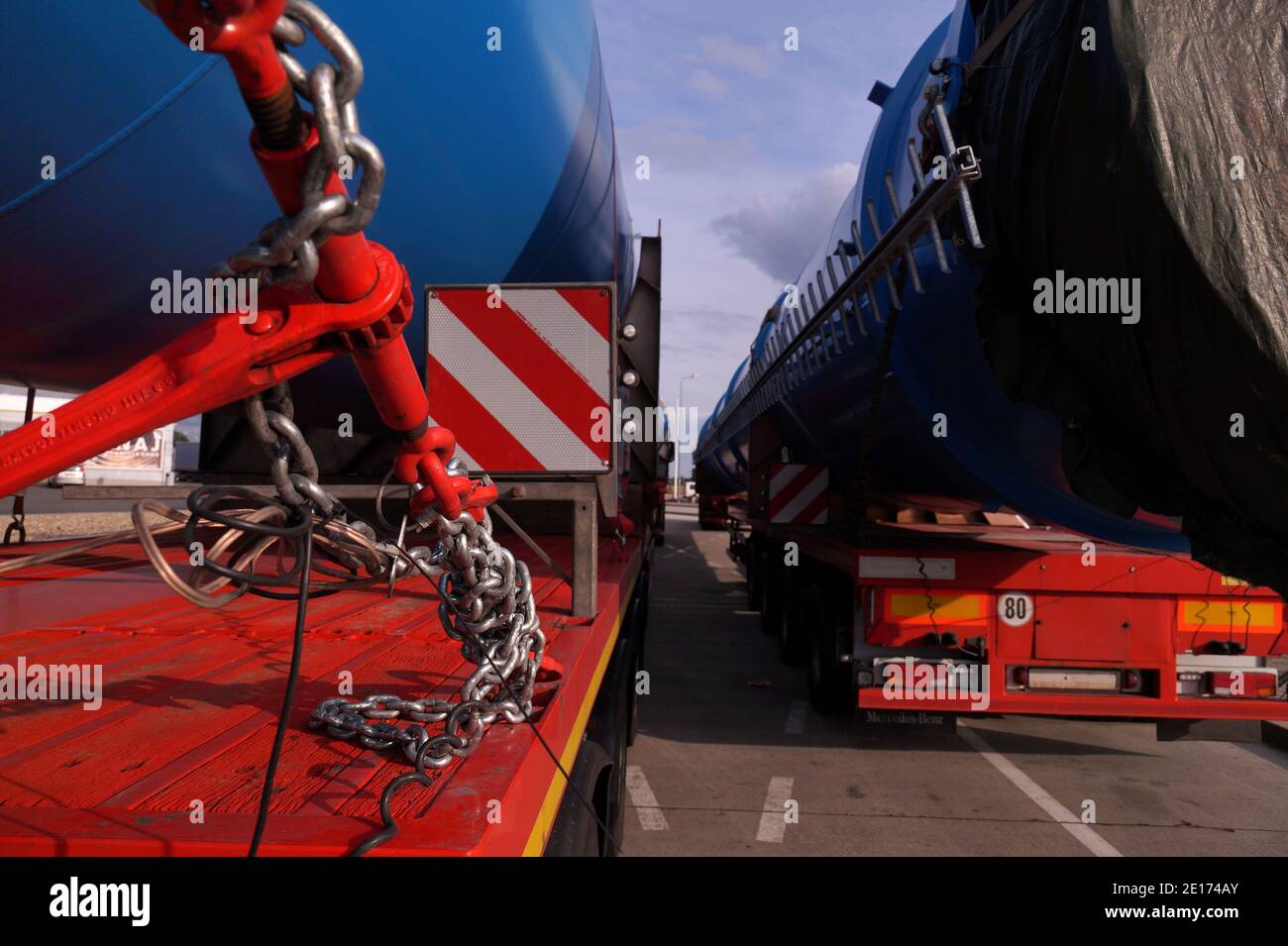 A two trucks with a special semi-trailers for transporting oversized ...