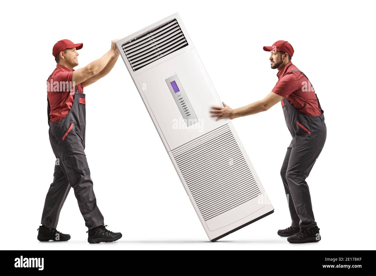 Workers in uniforms installing a self standing portable air ...
