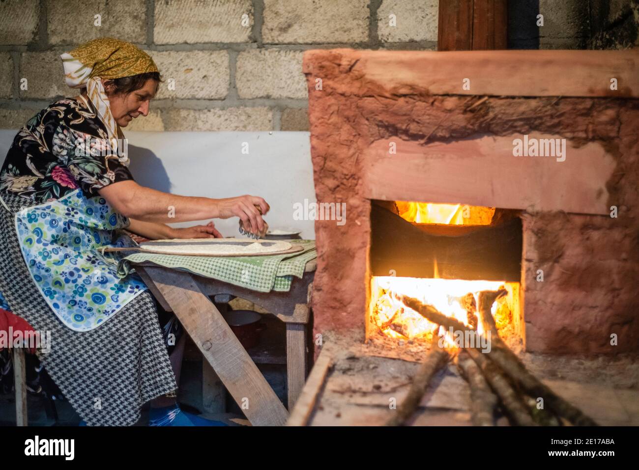 A housewife is making traditional Lezgi bread in Khazra village, Qusar ...