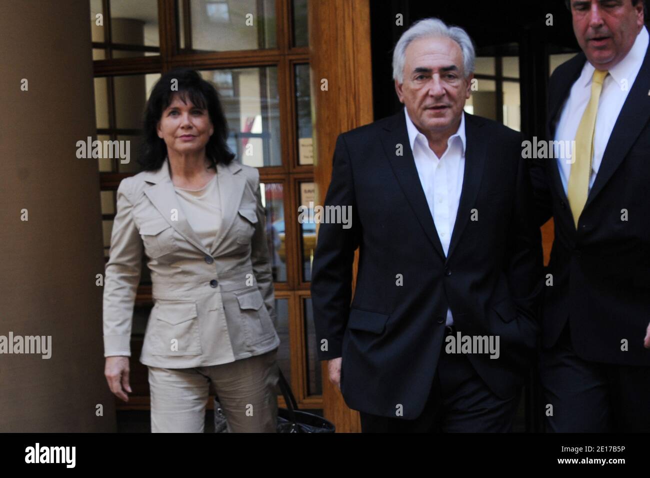 Former IMF Dominique Strauss-Kahn with his wife Anne Sinclair leave lawyer Ben Brafman's office ...