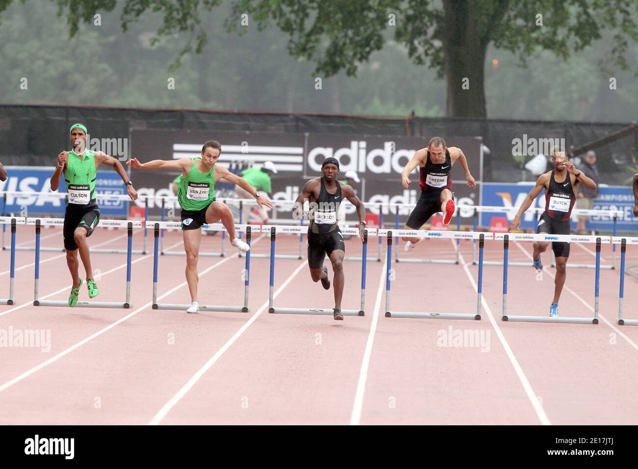 Athletes race the 400-meter hurdles during the adidas Grand Prix at ...