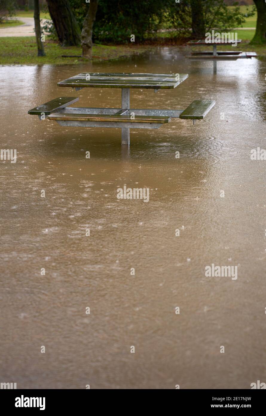 Picnic Ground Flooding. A flooded picnic ground and tables after heavy ...