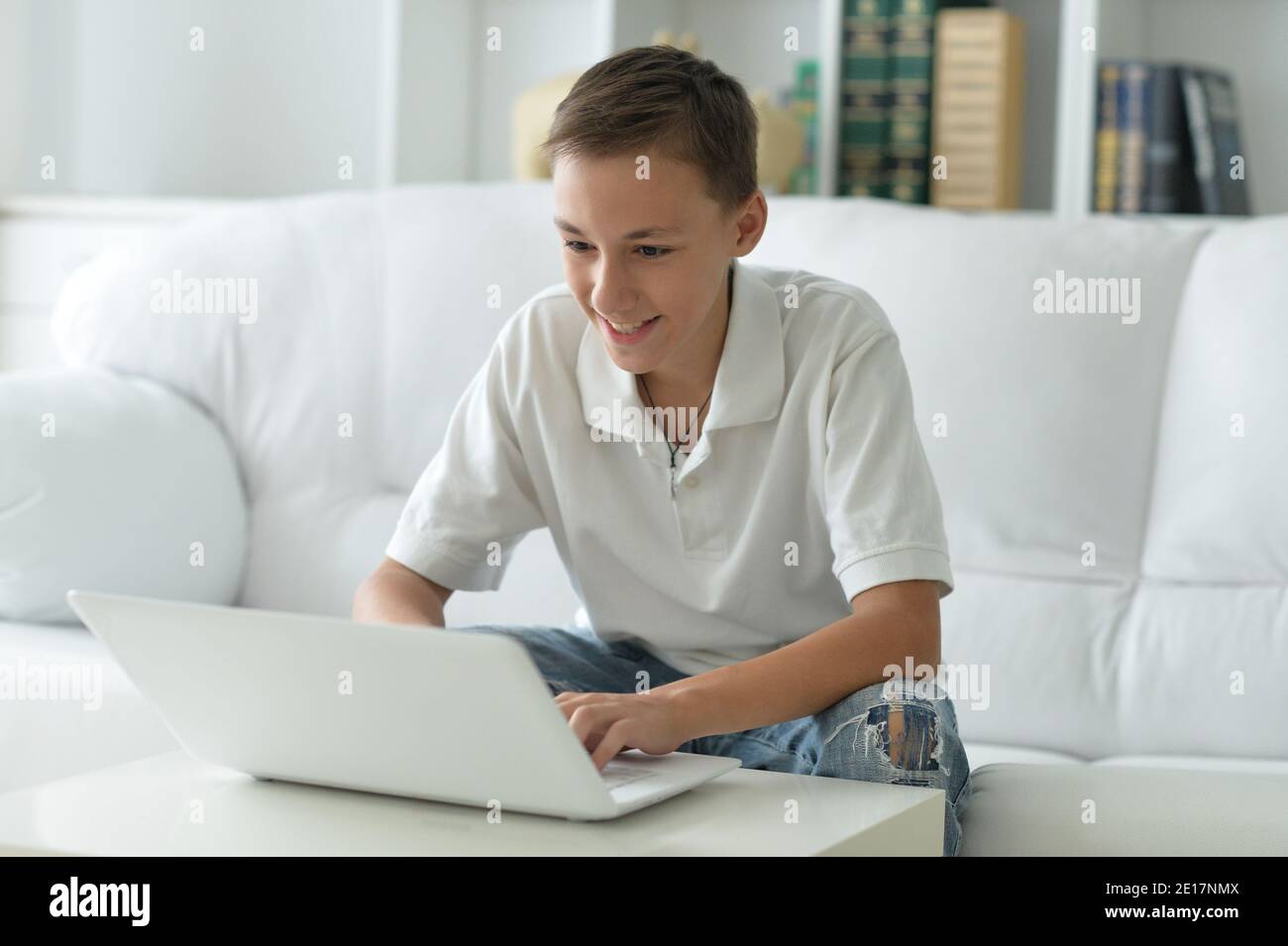 Happy cute boy using hi-res stock photography and images - Alamy